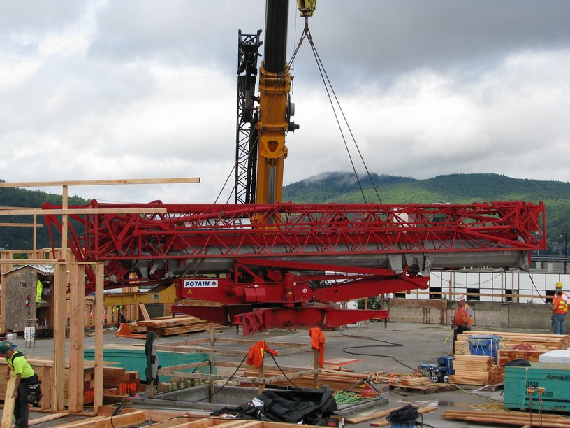 Grove 300T setting a Potain HDT80 on a second floor PT deck in Issaquah ...